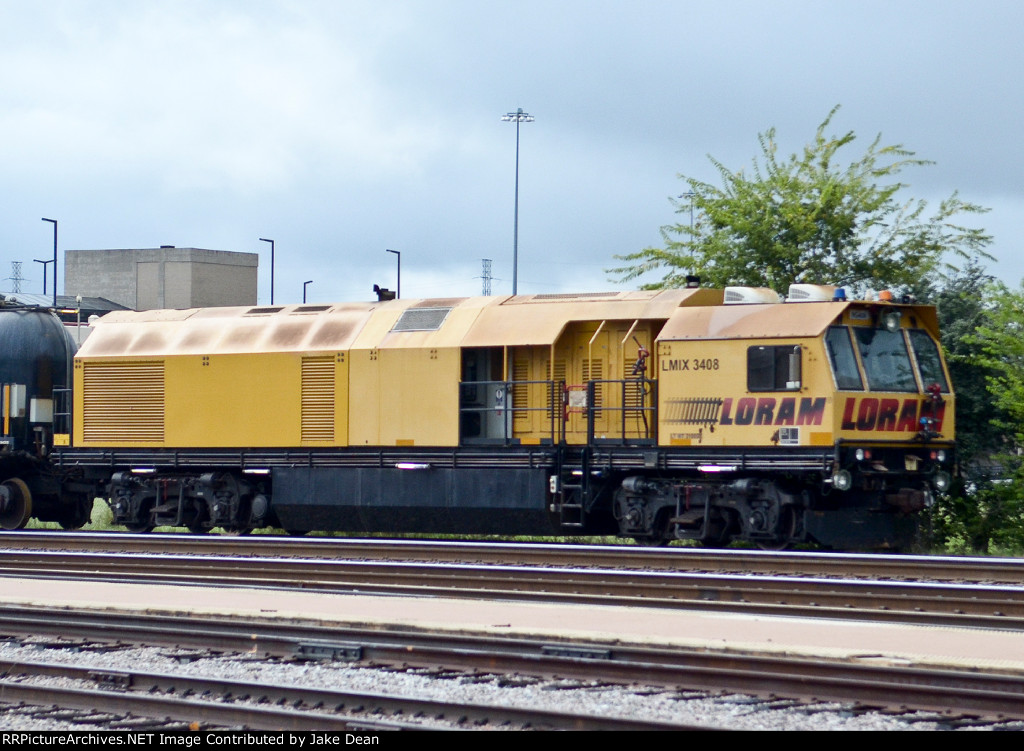 A Loram rail grinder train sitting south of Union Station with mechanical problems